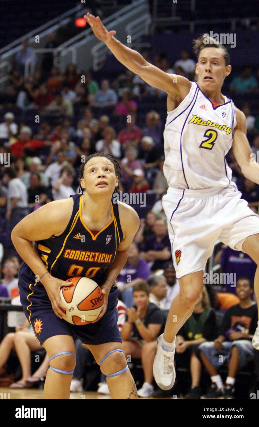 Connecticut Sun forward Tamika Whitmore, left, waits for Phoenix ...