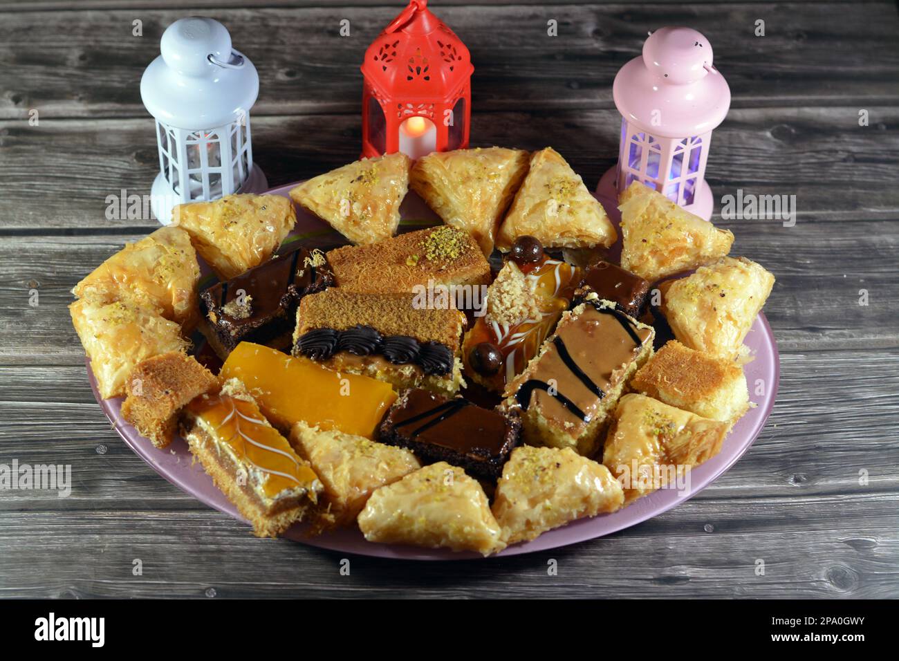 Eastern desserts with Ramadan lanterns, Konafa covered with mango ...