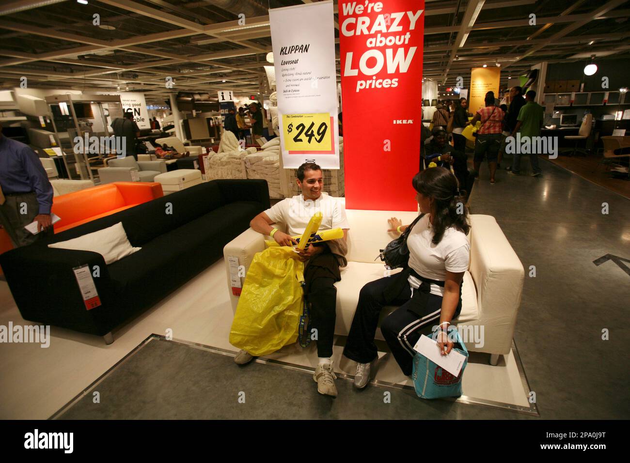 Angel Mendez and Mirna Martinez shop for a sofa during the grand opening of New York City's ...