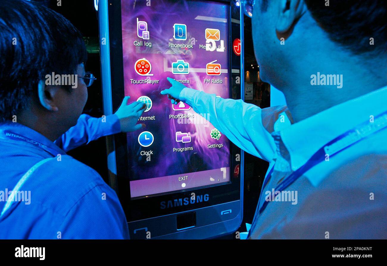 Visitors play with a giant version of the Samsung's newly launched ...
