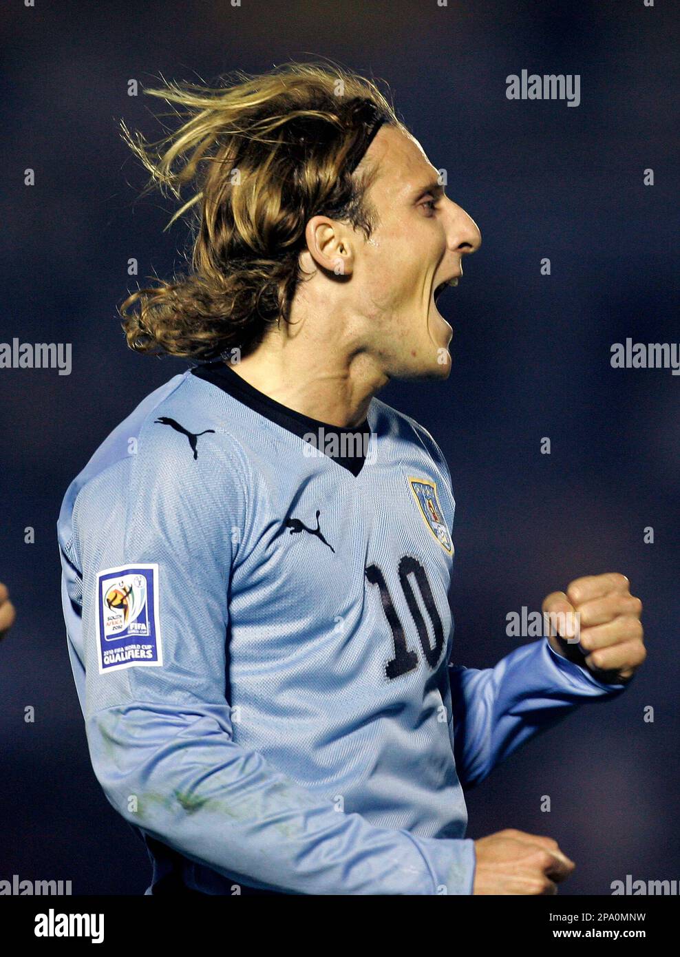 Uruguay's Diego Forlan celebrates after scoring during a World Cup 2010 ...