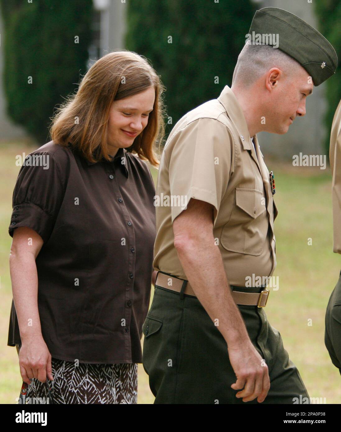 Marine Corps Lt. Col. Jeffrey Chessani, right, arrives with his wife ...