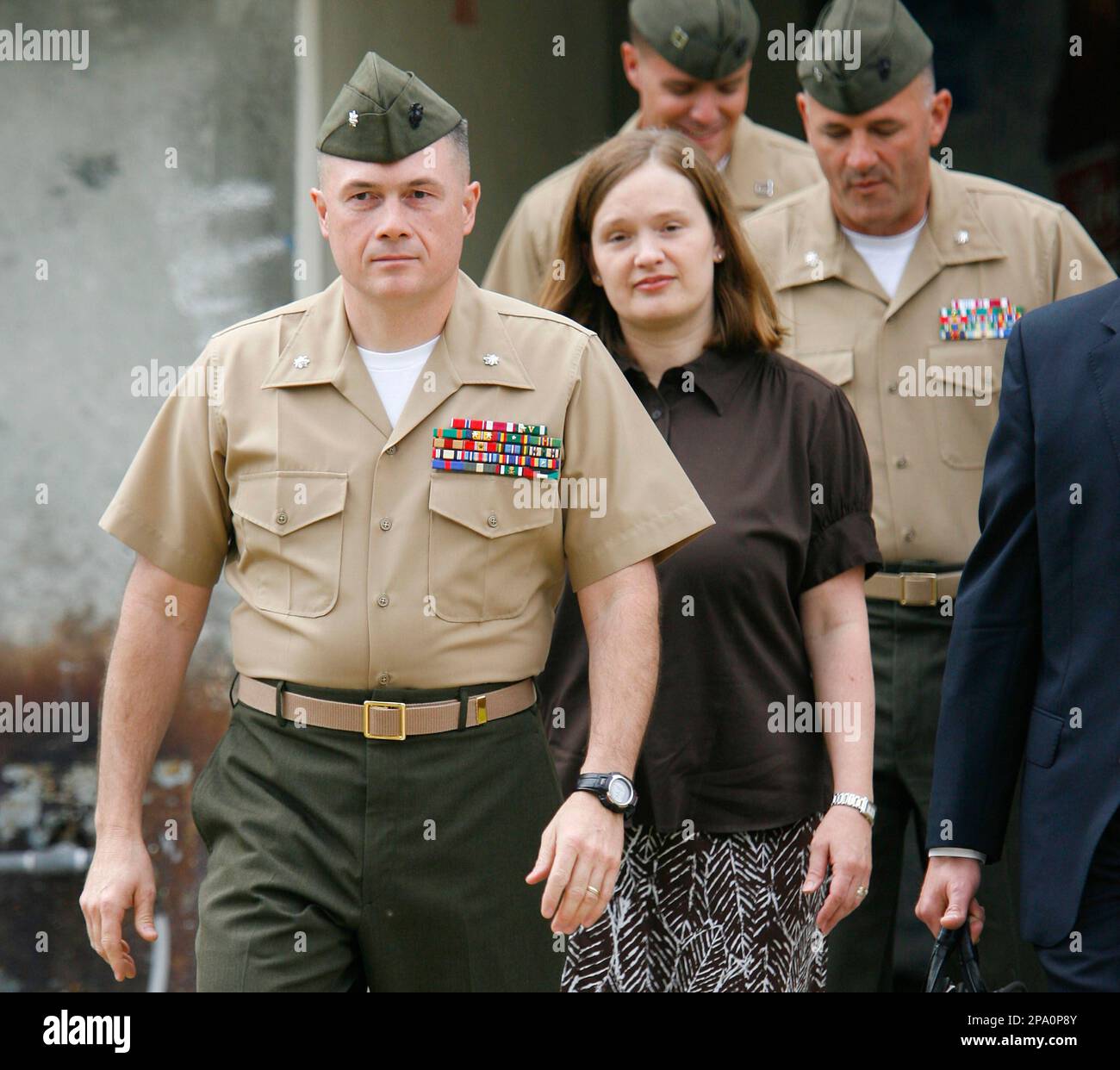 Marine Corps Lt. Col. Jeffrey Chessani, left, arrives with his wife ...