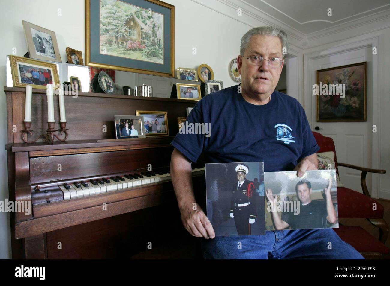 Mike Mulkey father of fallen firefighter Capt. Louis Mulkey, hold some ...