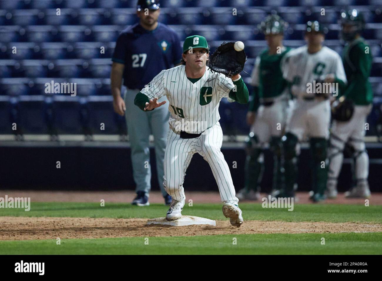 Charlotte 49ers first baseman Brandon Stahlman (19) stretches for a ...