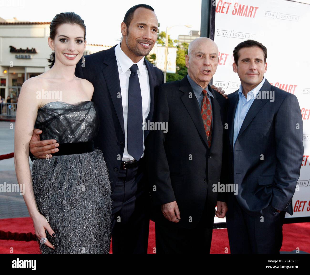 Cast members, from left, Anne Hathaway, Dwayne Johnson, Alan Arkin, and ...
