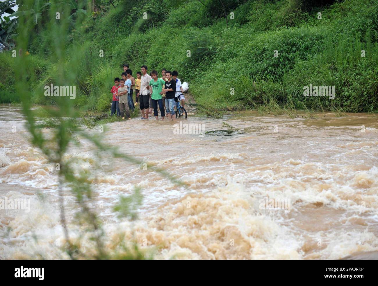 In this photo released by China's Xinhua News Agency, local people ...
