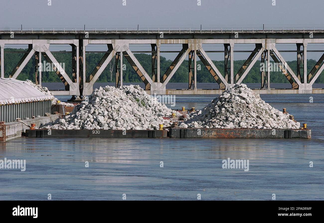 Barges loaded with rocks sit ready for emergency use if a levy breaks ...
