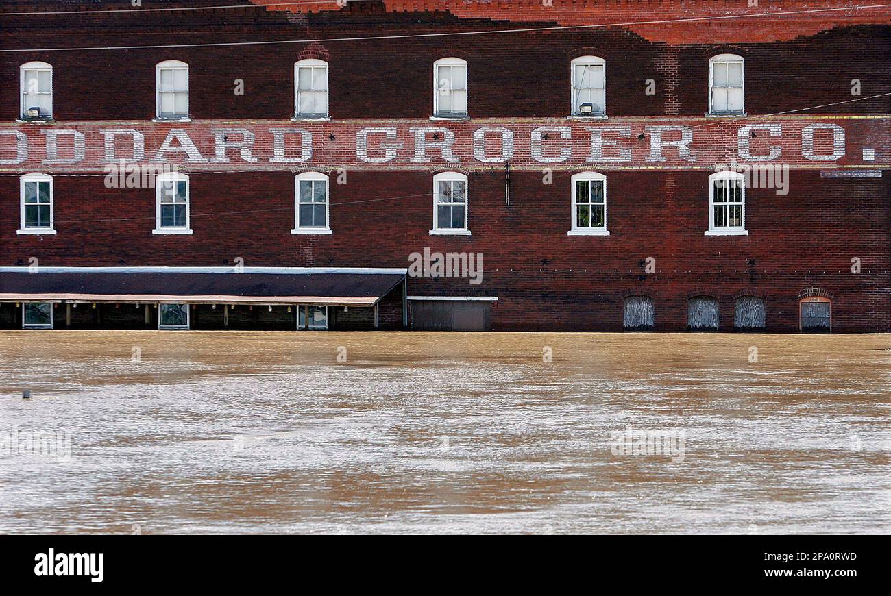 An old grocery store which is now a restaurant is flooded along the ...