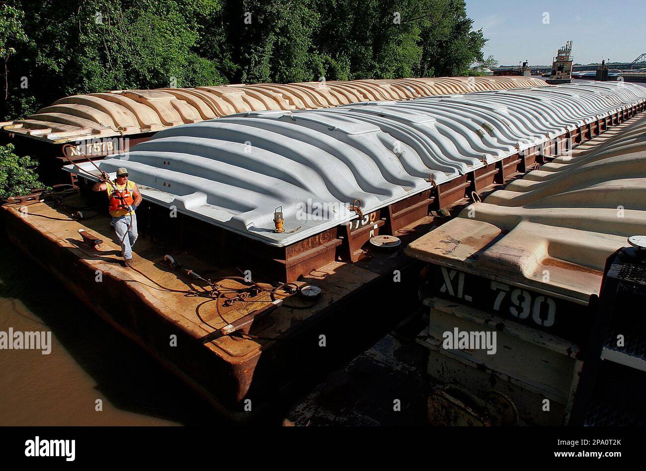 Towboat Senior Deckhand Al Davis retires barges he anchored earlier on ...
