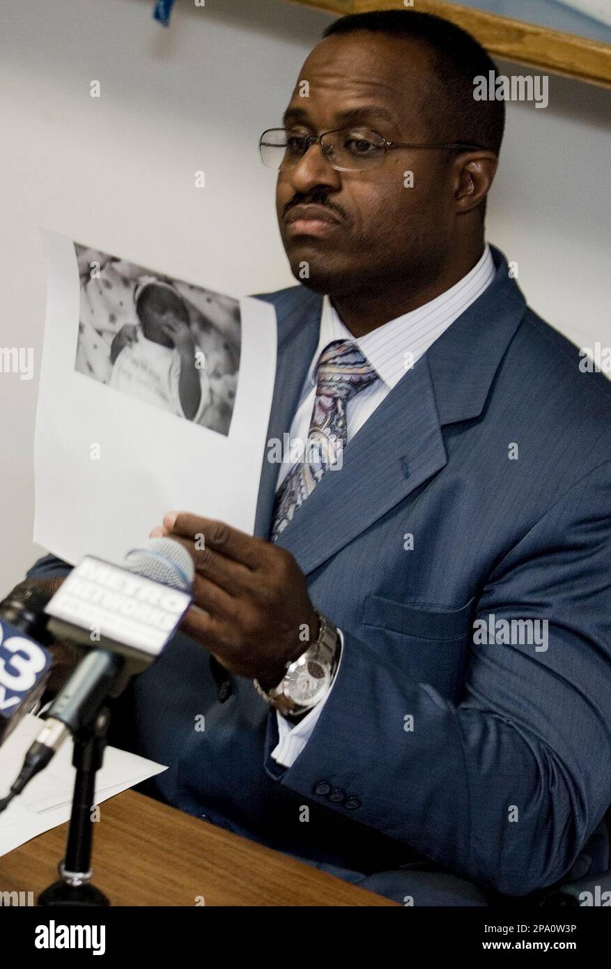 Police Detective Lamonte Adams holds a picture of two-month-old baby ...