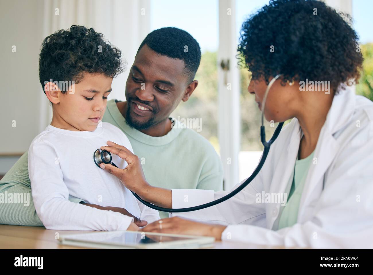 African dad, child and woman doctor with stethoscope in doctors office ...