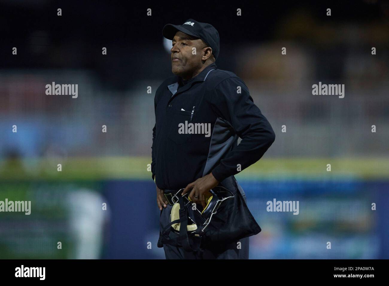 Home plate umpire David Brown works the NCAA baseball game between the ...
