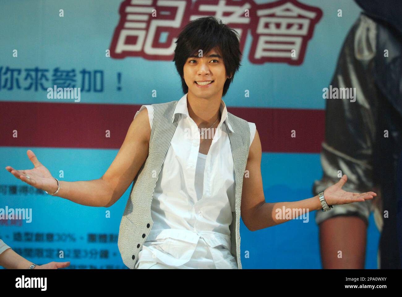 Taiwan singer Show smiles to photographers during a media event ...
