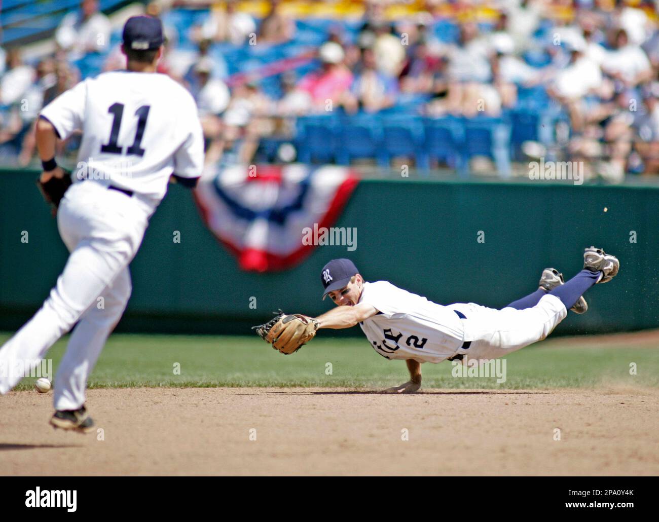 Rice second baseman Jimmy Comerota (2), leaps for a ball hit by Fresno ...