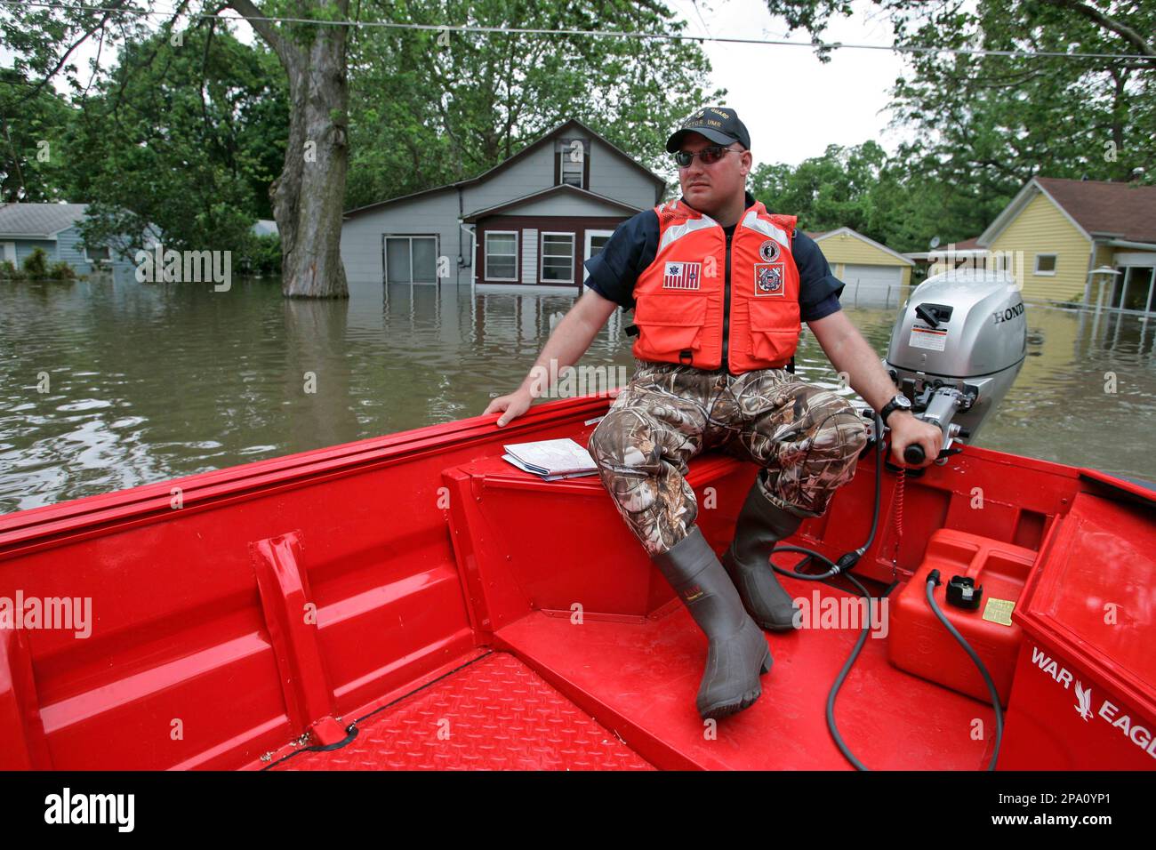 Coast Guard Petty Officer first class Don Smith pilots a boat through ...
