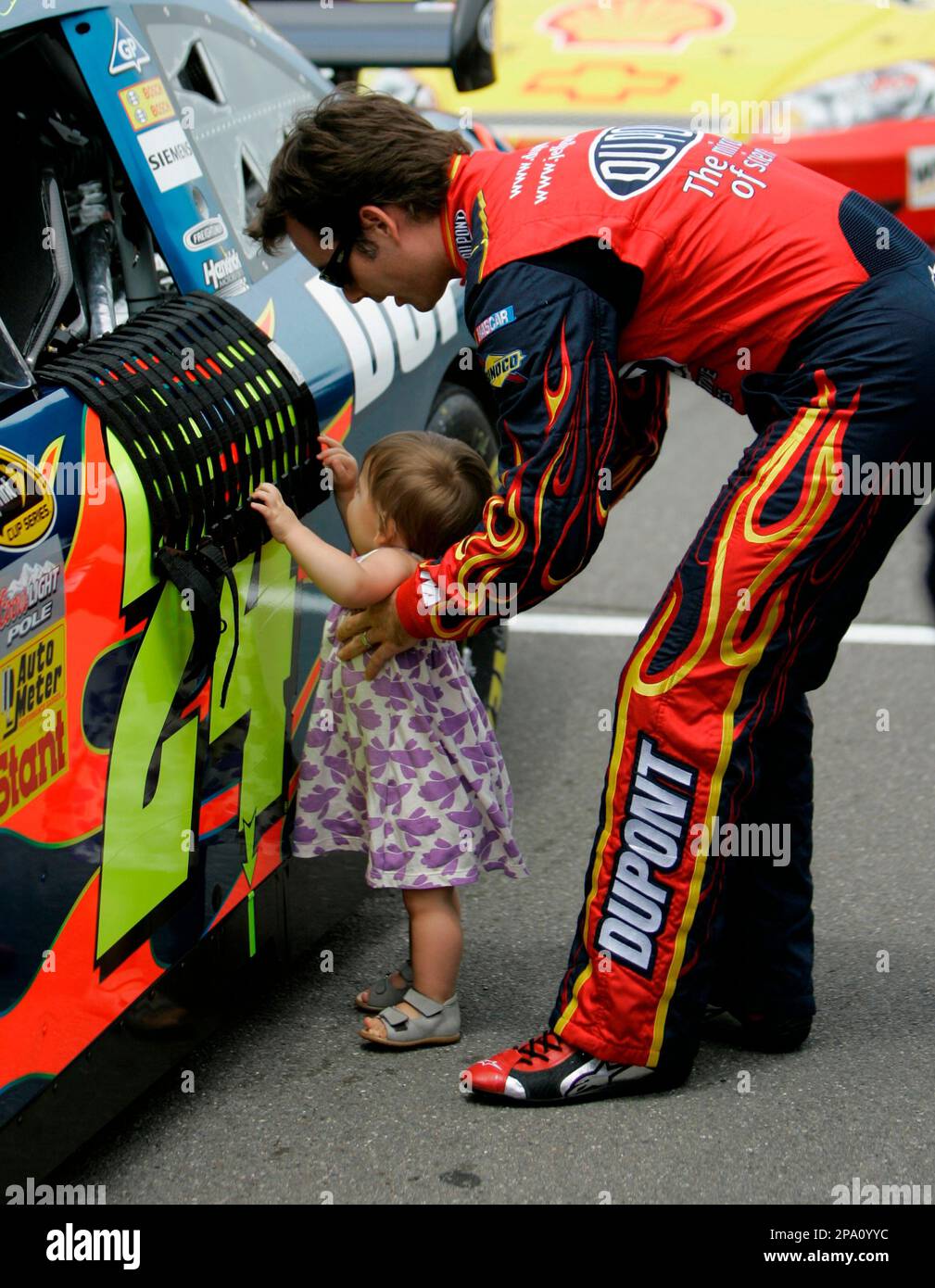 NASCAR Sprint Cup Series driver Jeff Gordon holds his daughter Ella ...