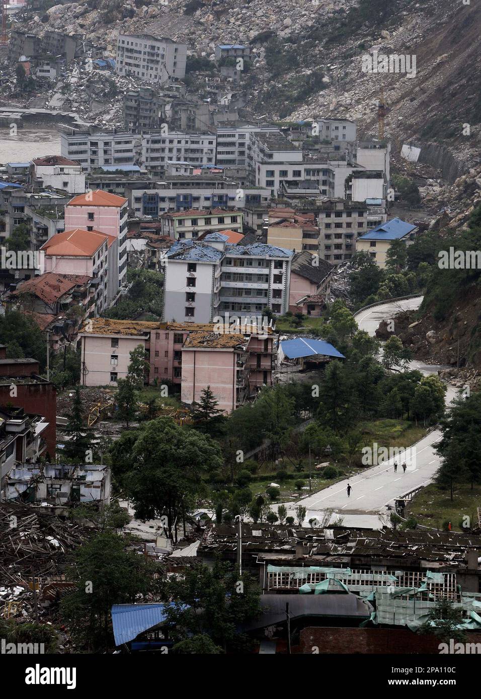 Residents walk toward the quake-hit Beichuan county, southwest China's ...