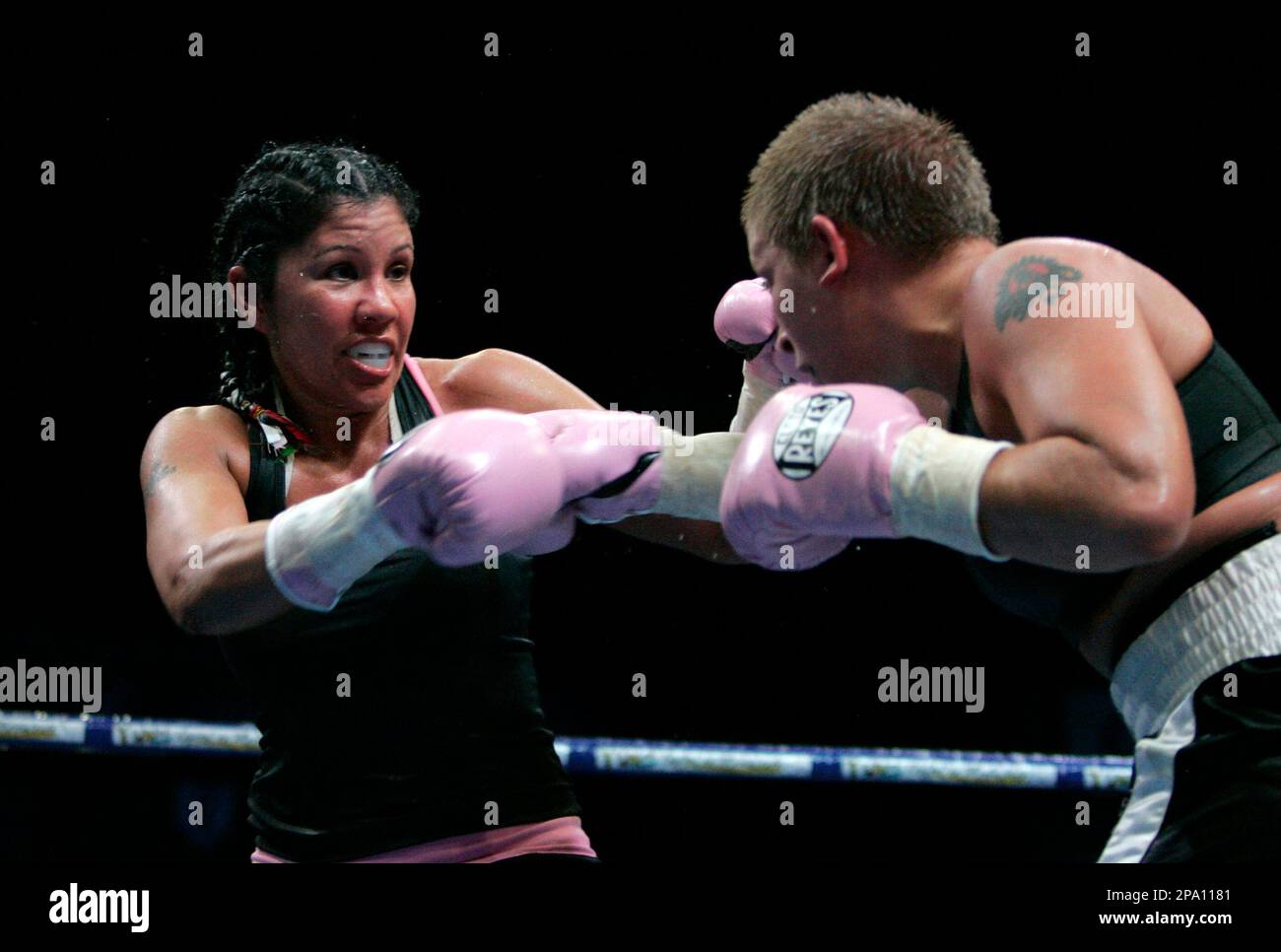 Mia St. John, left, throws a punch at Amy Yuratovac during their WBC Female Welterweight title ...