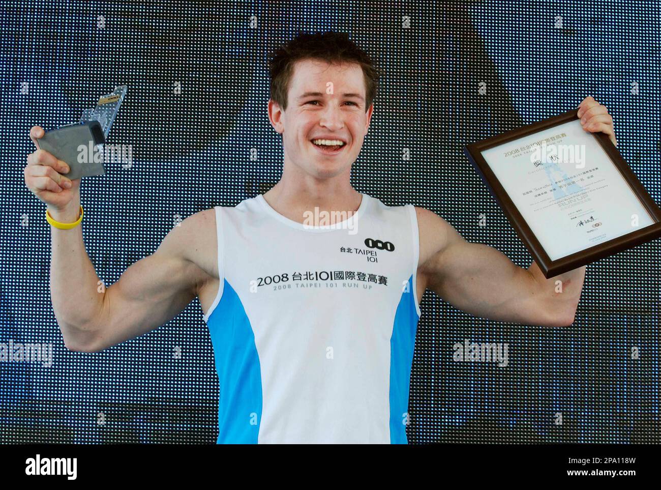 Germany's Thomas Dold proudly shows off his trophy and certificate ...