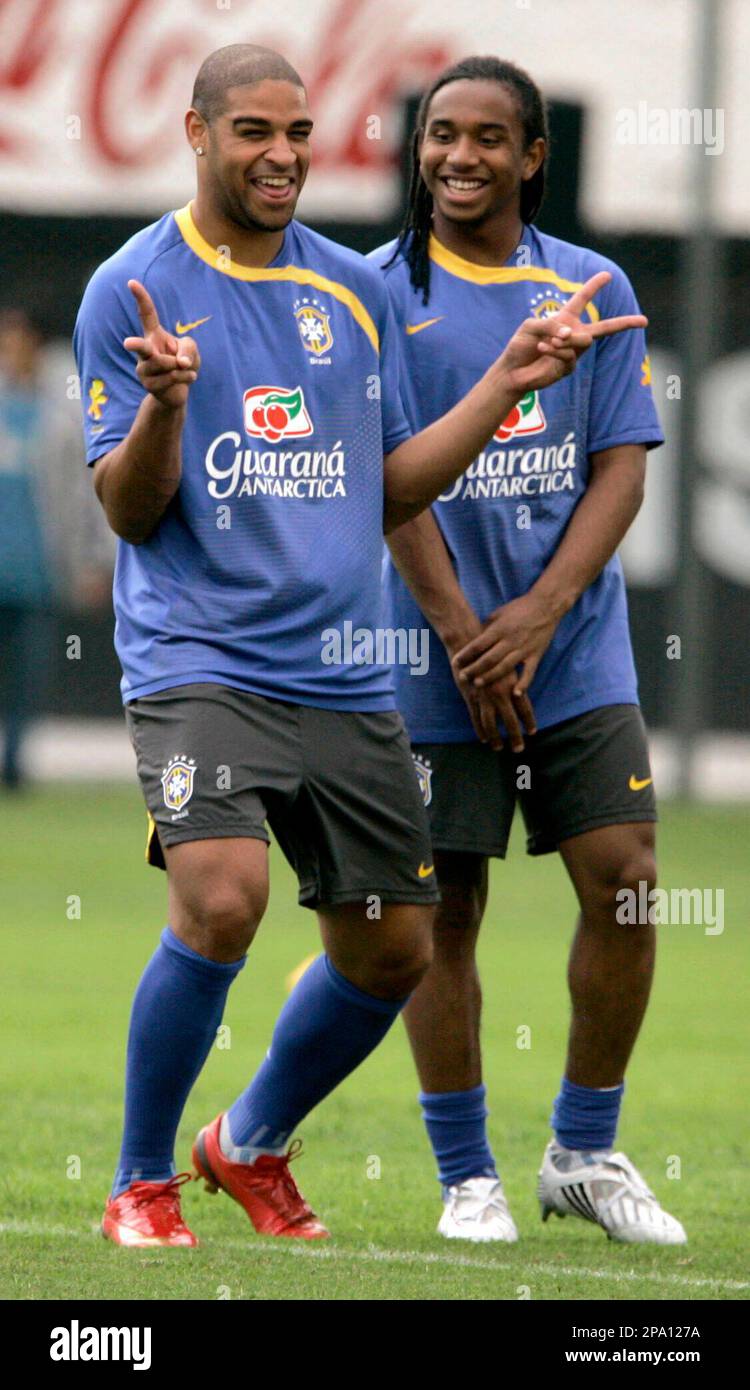Brazil's Adriano, left, and Anderson joke around during a training ...