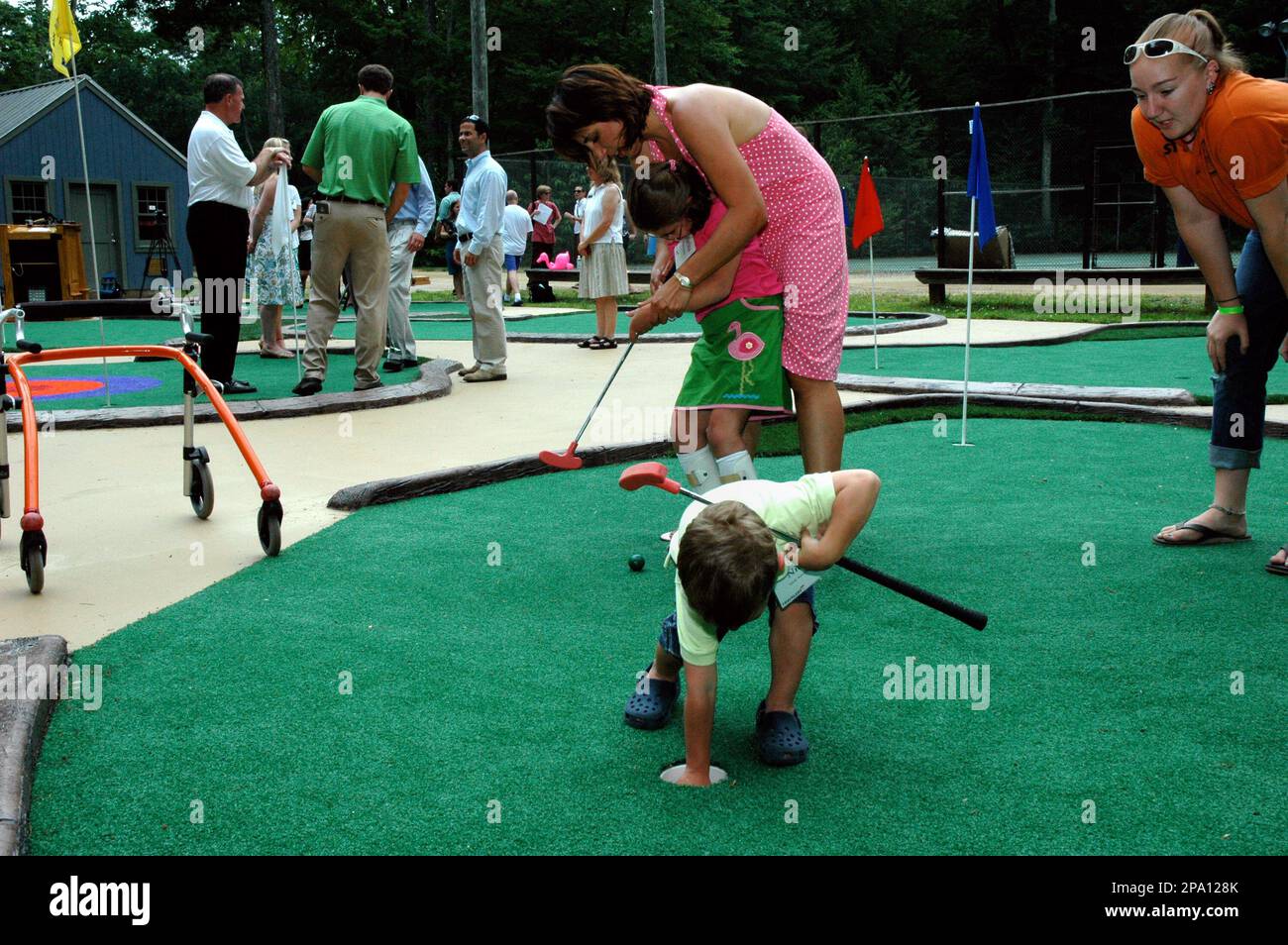 Nicholas Seminara, 2, retrieves his ball on a new handicap-accessible ...