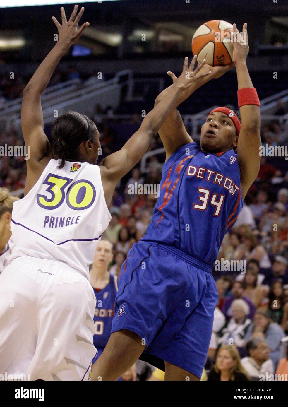 Detroit Shock forward Tasha Humphrey, right, attempts a basket over ...