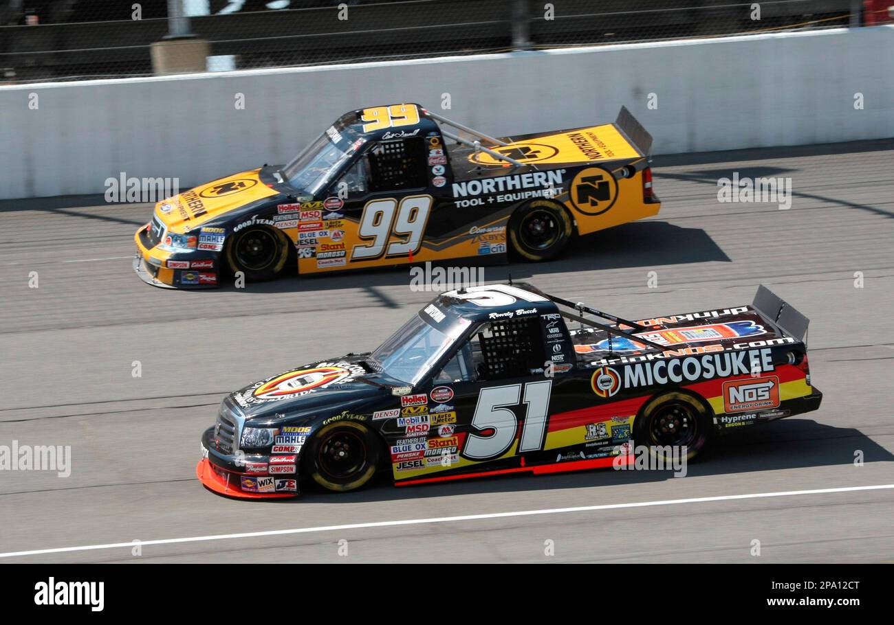 Kyle Busch (51) and Erik Darnell (99) are seen in the NASCAR Craftsman ...