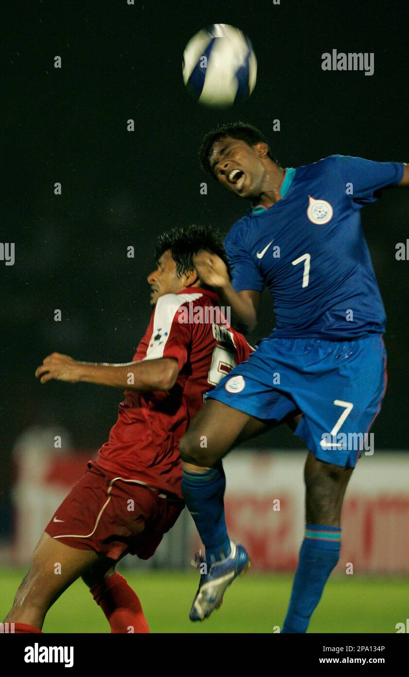 India's N.P.Pradeep, right and Maldives's Ibrahim Fazeel challenge for ...