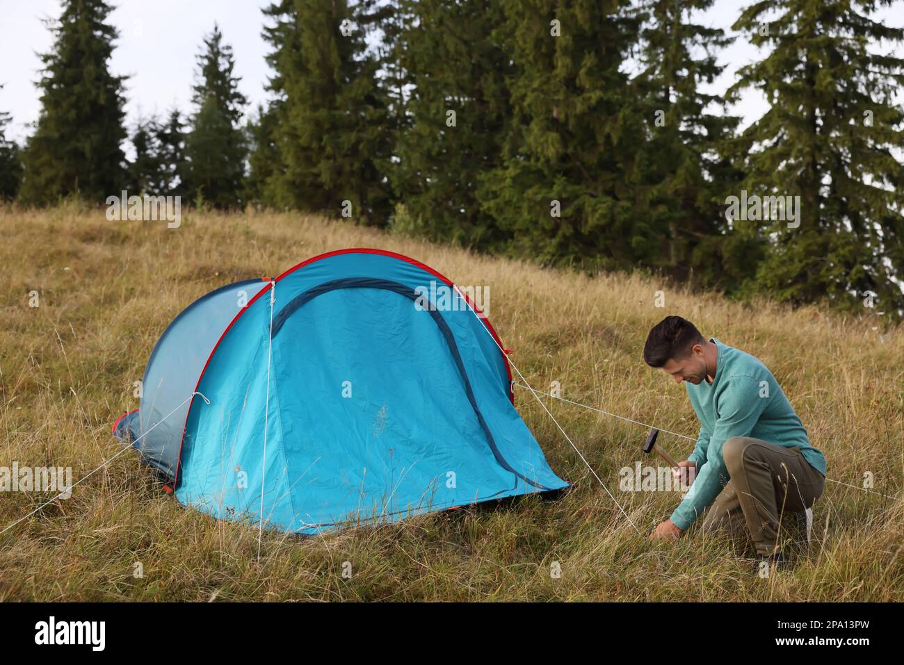 Setting up tent on camping hi-res stock photography and images - Alamy