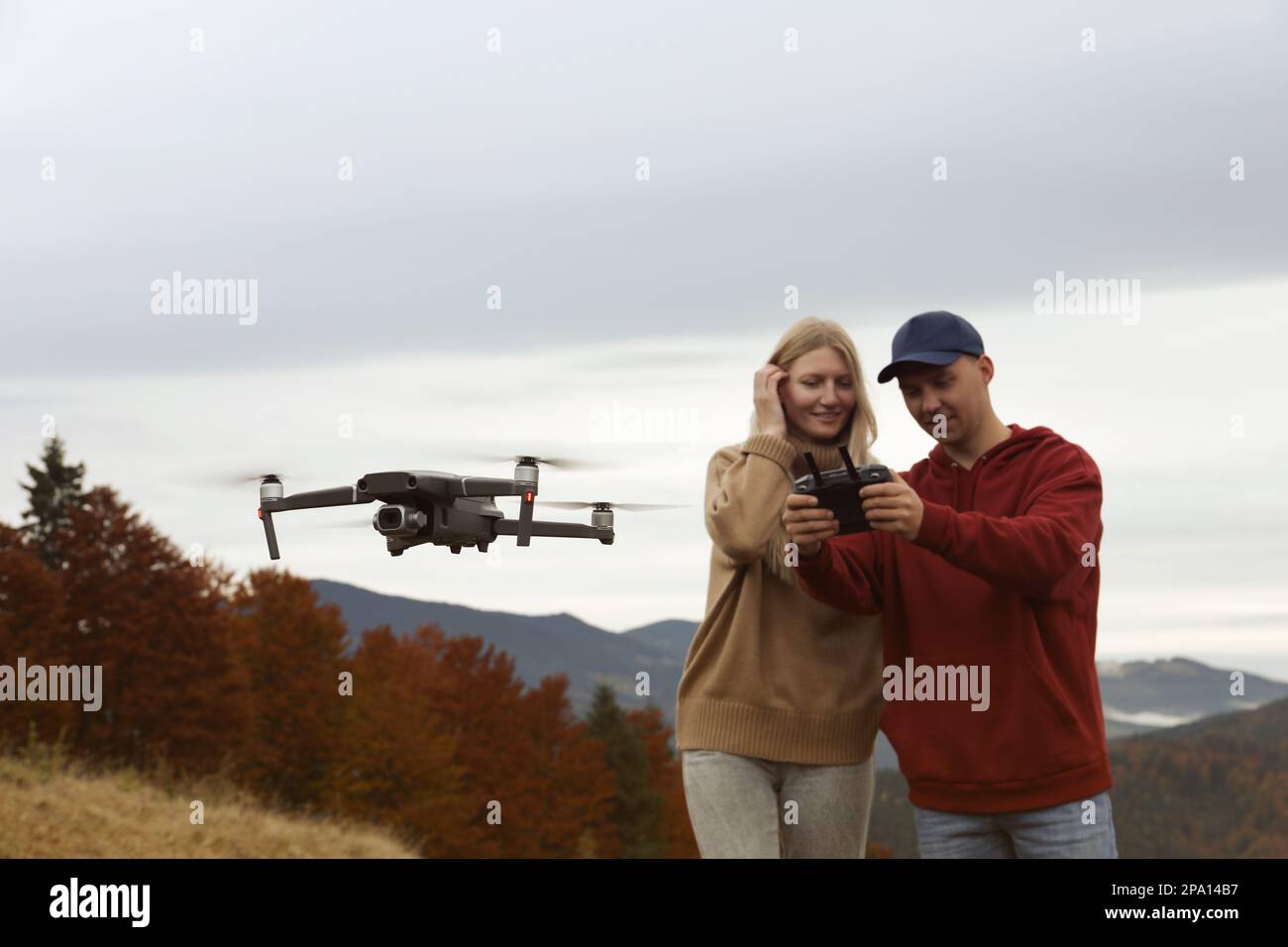 Operating drone in mountains hi-res stock photography and images - Alamy