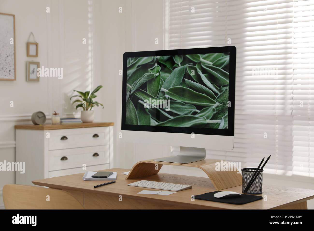 Comfortable workplace with modern computer near window in room Stock ...
