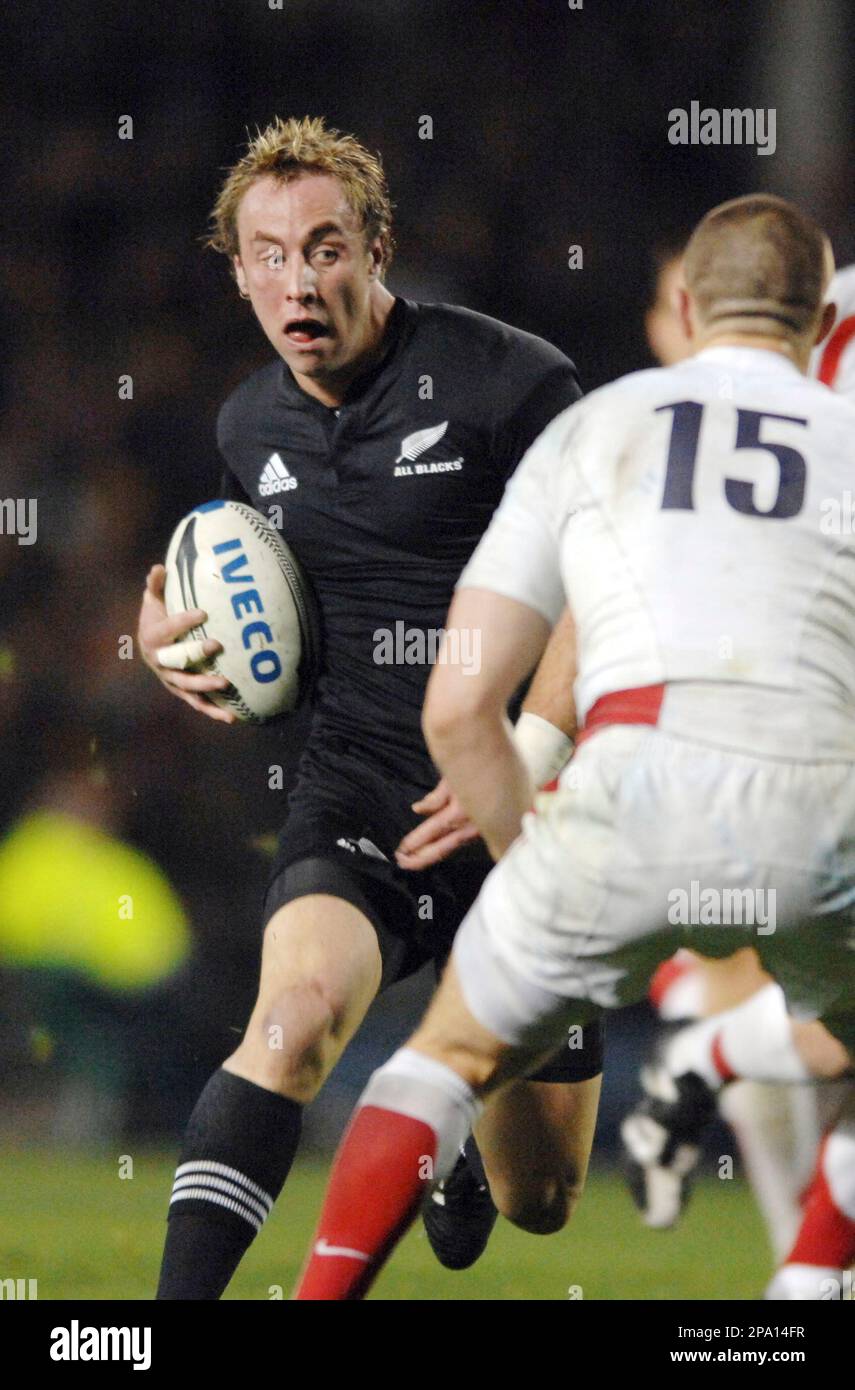 New Zealand's Jimmy Cowan, left, runs at England's Mike Brown during ...