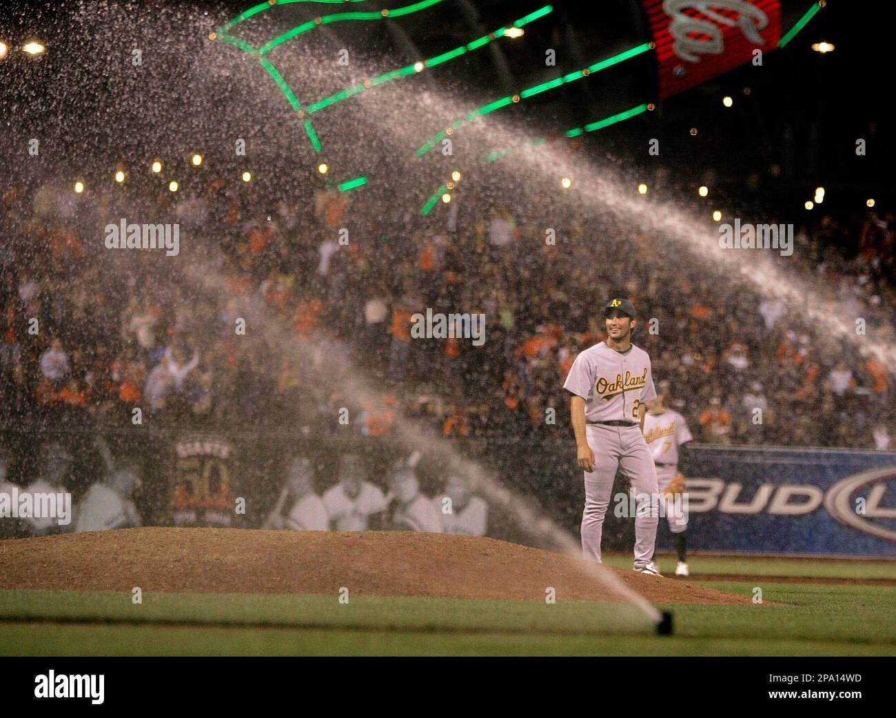 Oakland Athletics' pitcher Huston Street (20) smiles as he is drenched ...
