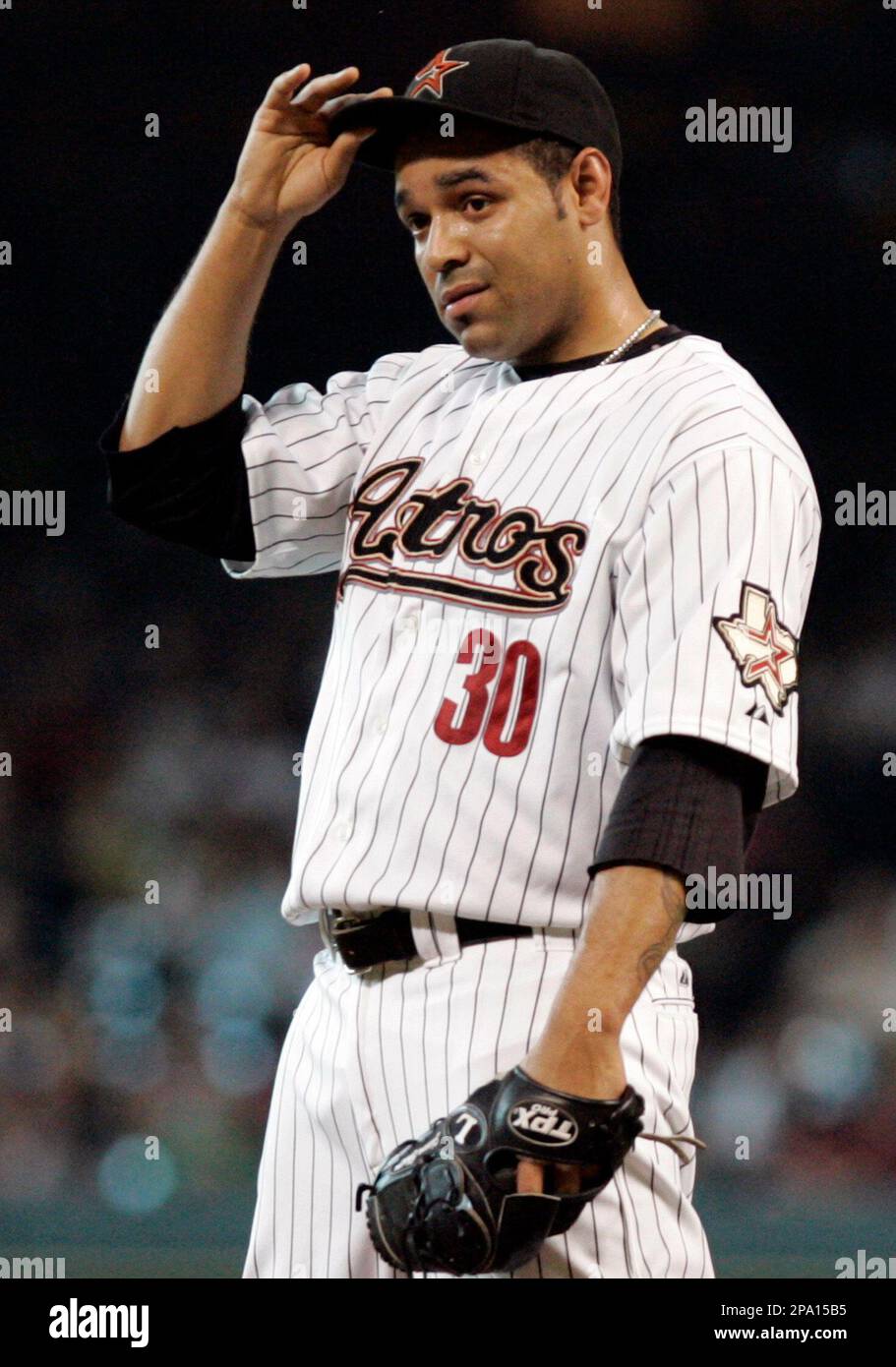 Houston Astros pitcher Shawn Chacon adjusts his cap during the first ...
