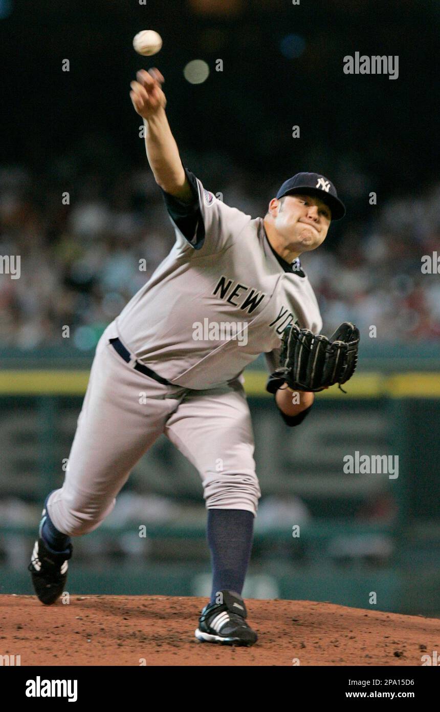 New York Yankees' Joba Chamberlain delivers a pitch in the first inning ...