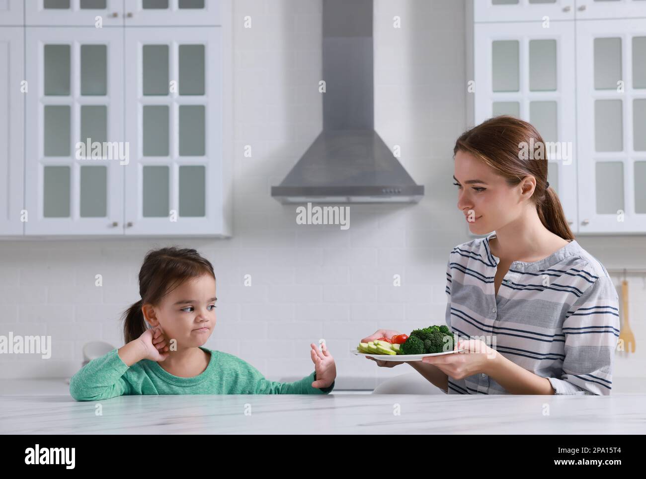 Girl rejecting plate hi-res stock photography and images - Alamy