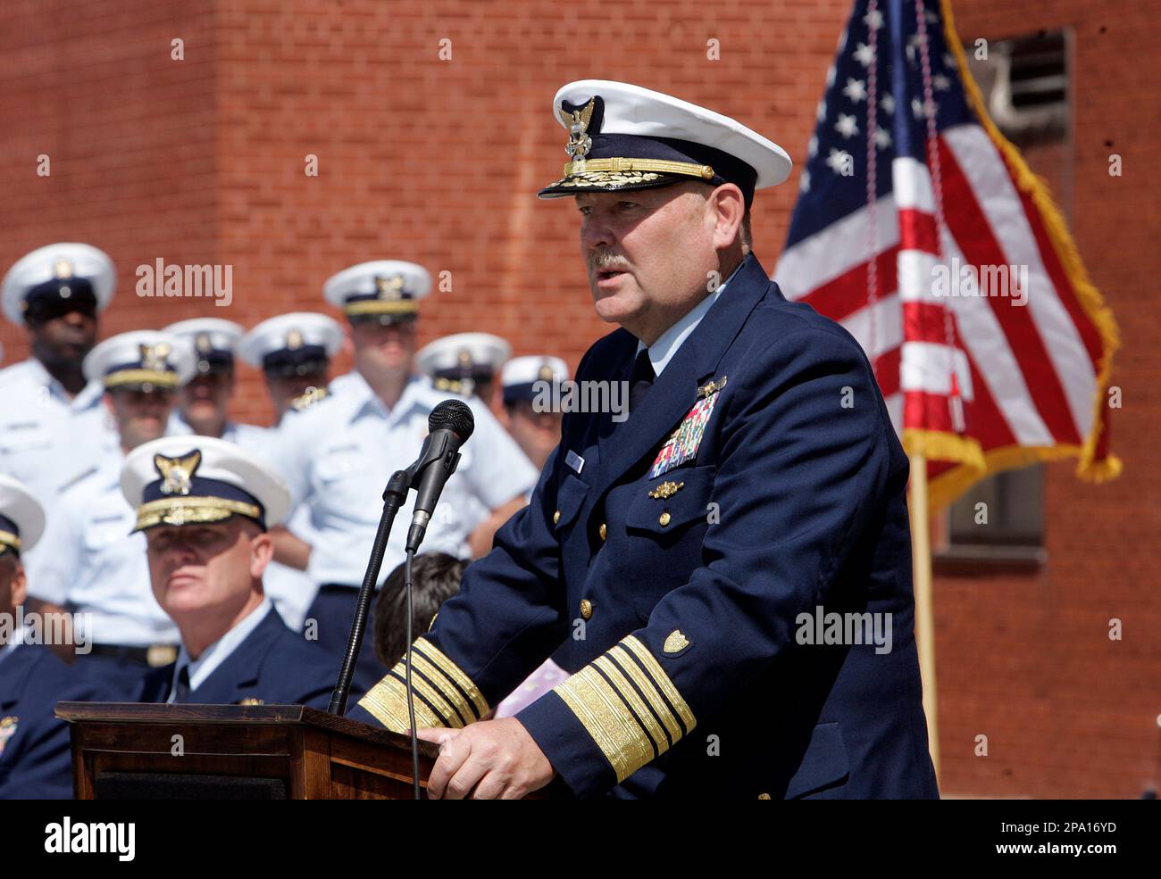 Adm. Thad W. Allen delivers the main address at a ceremony opening the ...