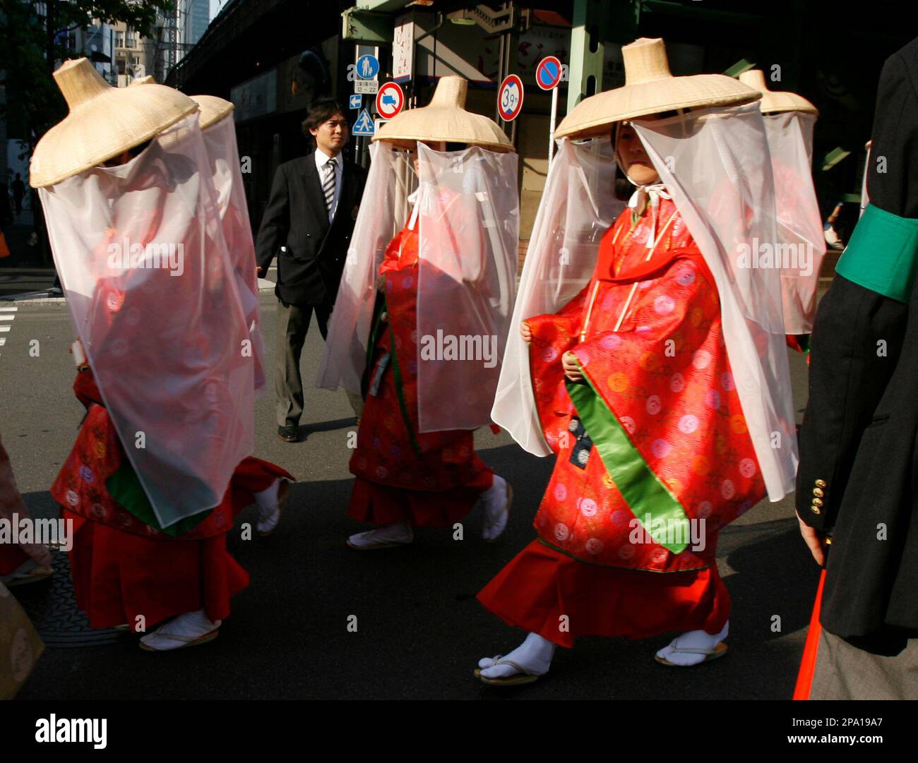 Festival goers dressed in Japanese mid-age dynasty costumes parade ...