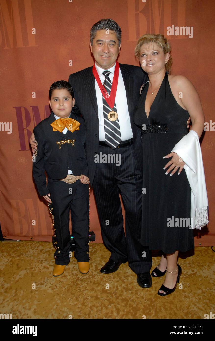 Composer Victor Cordero Aurrecoechea, center, arrives with his wife and ...