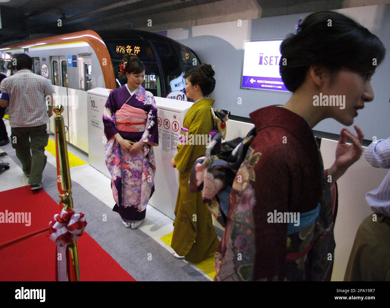 Kimono-clad models wait for a ceremony marking the launch of Tokyo's ...