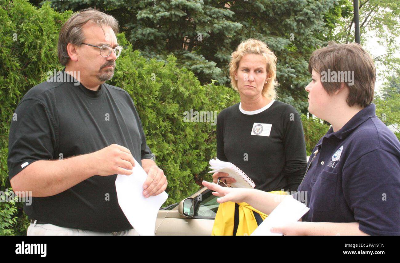 Portage, Wis., Mayor Ken Jahn listens to FEMA spokeswoman Hannah Vick ...