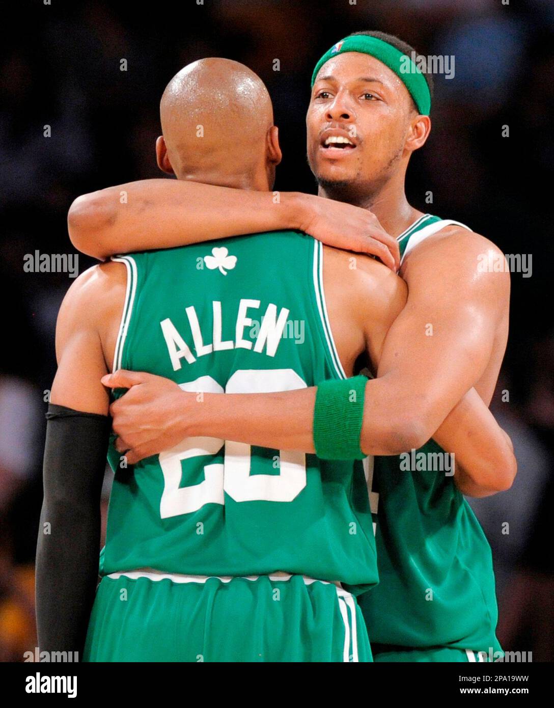 Boston Celtics forward Paul Pierce hugs teammate Ray Allen (20) after ...