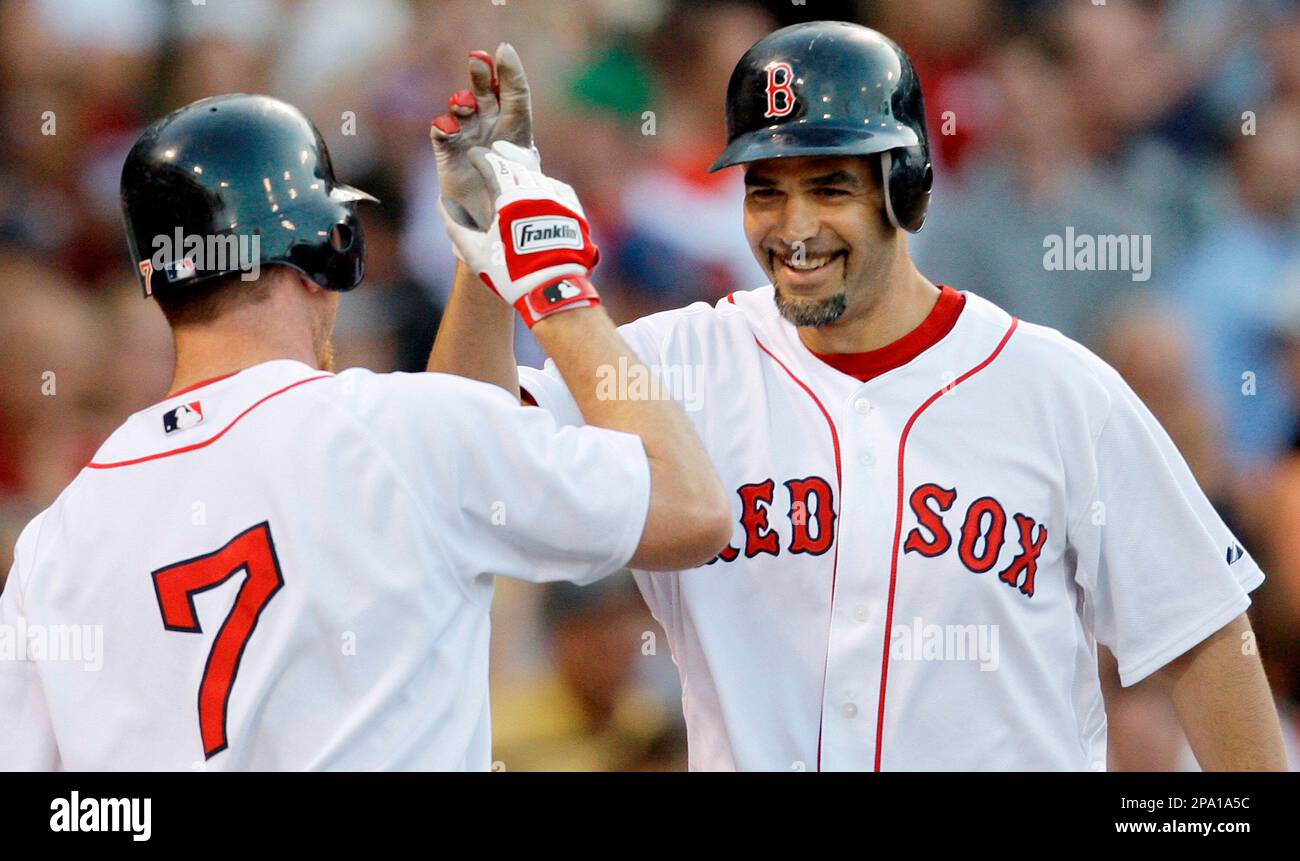 Boston Red Sox's Mike Lowell, right, is congratulated by teammate J.D ...