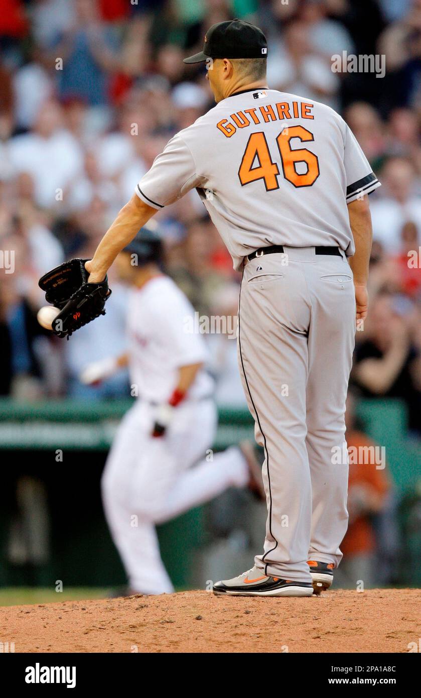 Baltimore Orioles starter Jeremy Guthrie (46) gets a fresh baseball as ...