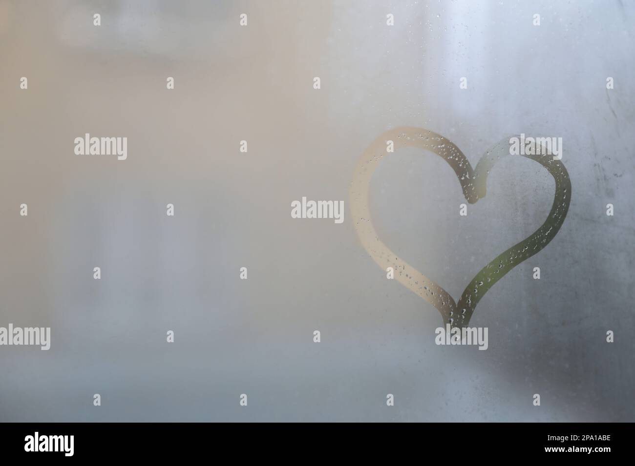 Heart drawn on foggy window, space for text. Rainy weather Stock Photo ...