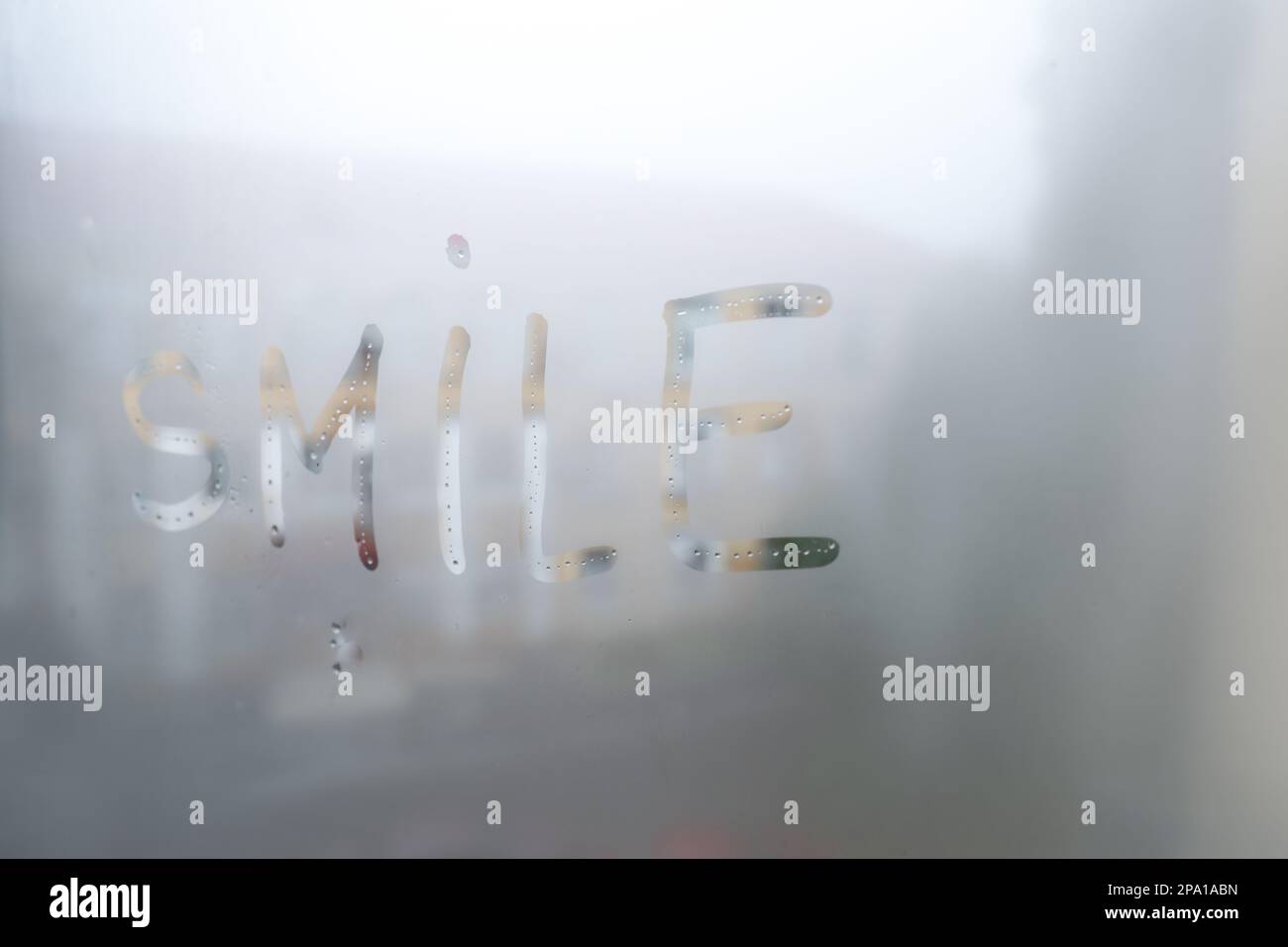 Word SMILE written on foggy window. Rainy weather Stock Photo - Alamy