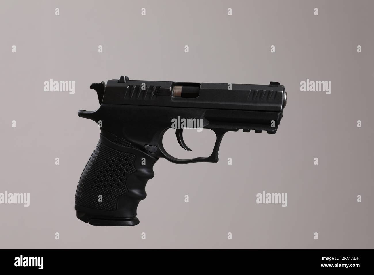 Standard handgun on light grey background. Semi-automatic pistol Stock ...