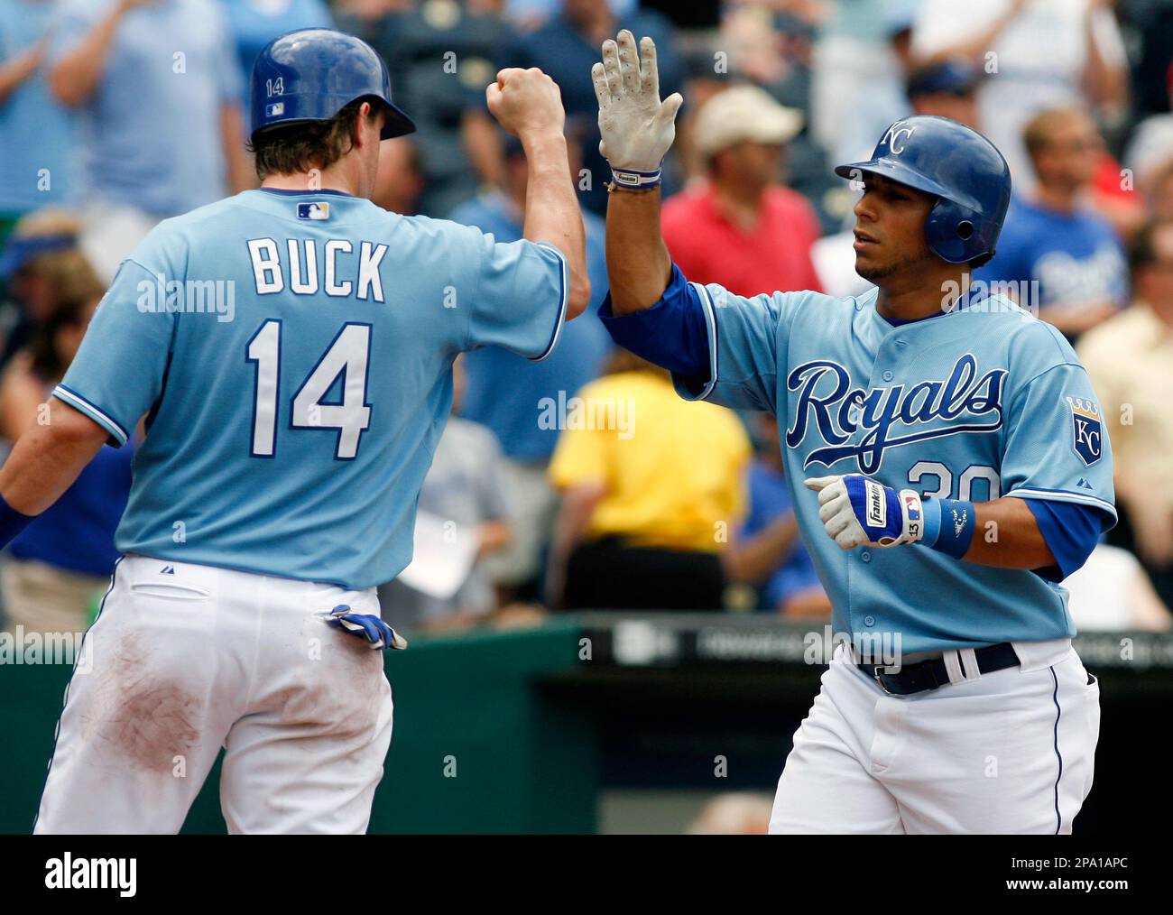 Kansas City Royals' Mike Aviles, right, celebrates his two-run home run ...