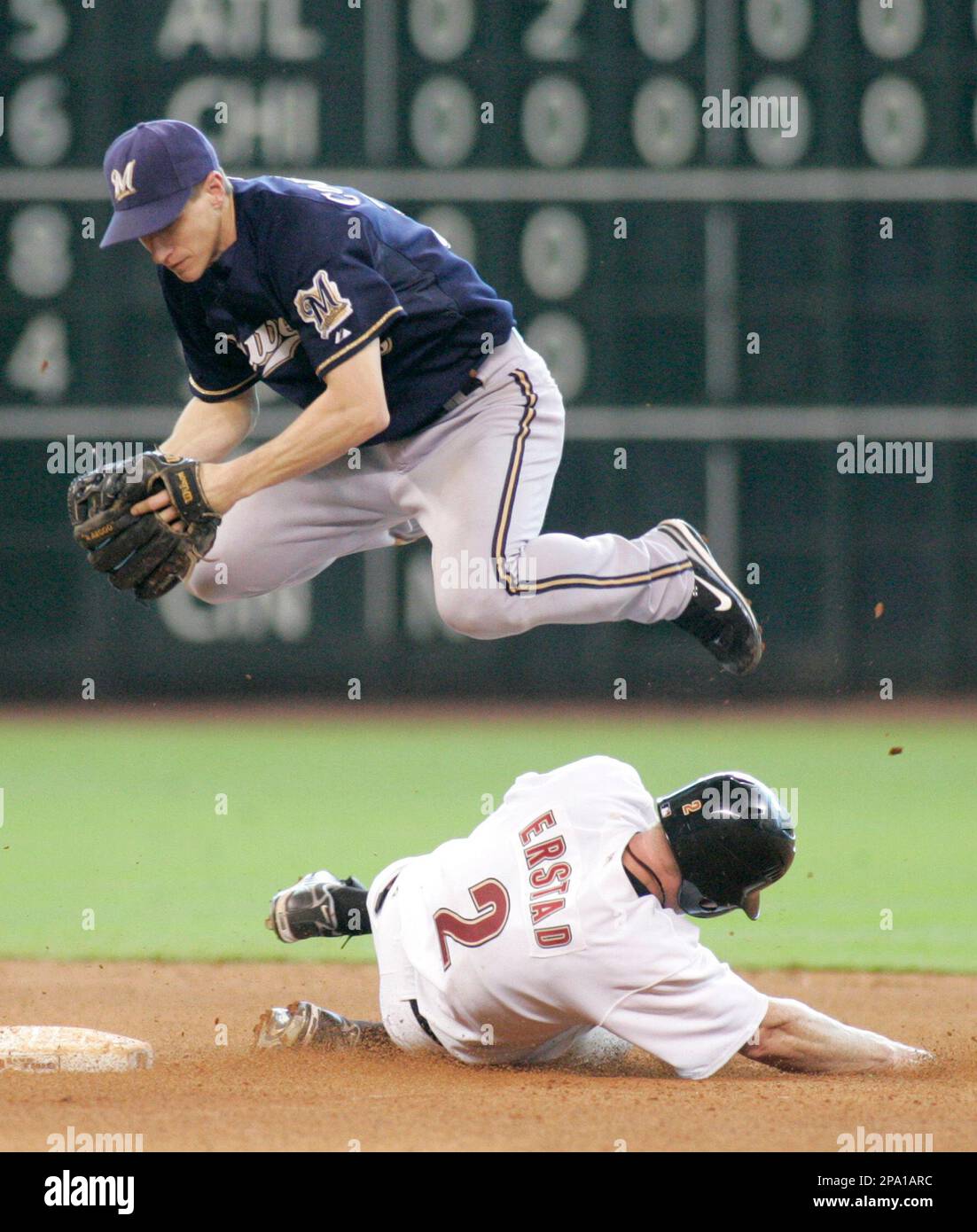 Milwaukee Brewers shortstop Craig Counsell jumps high to avoid a ...